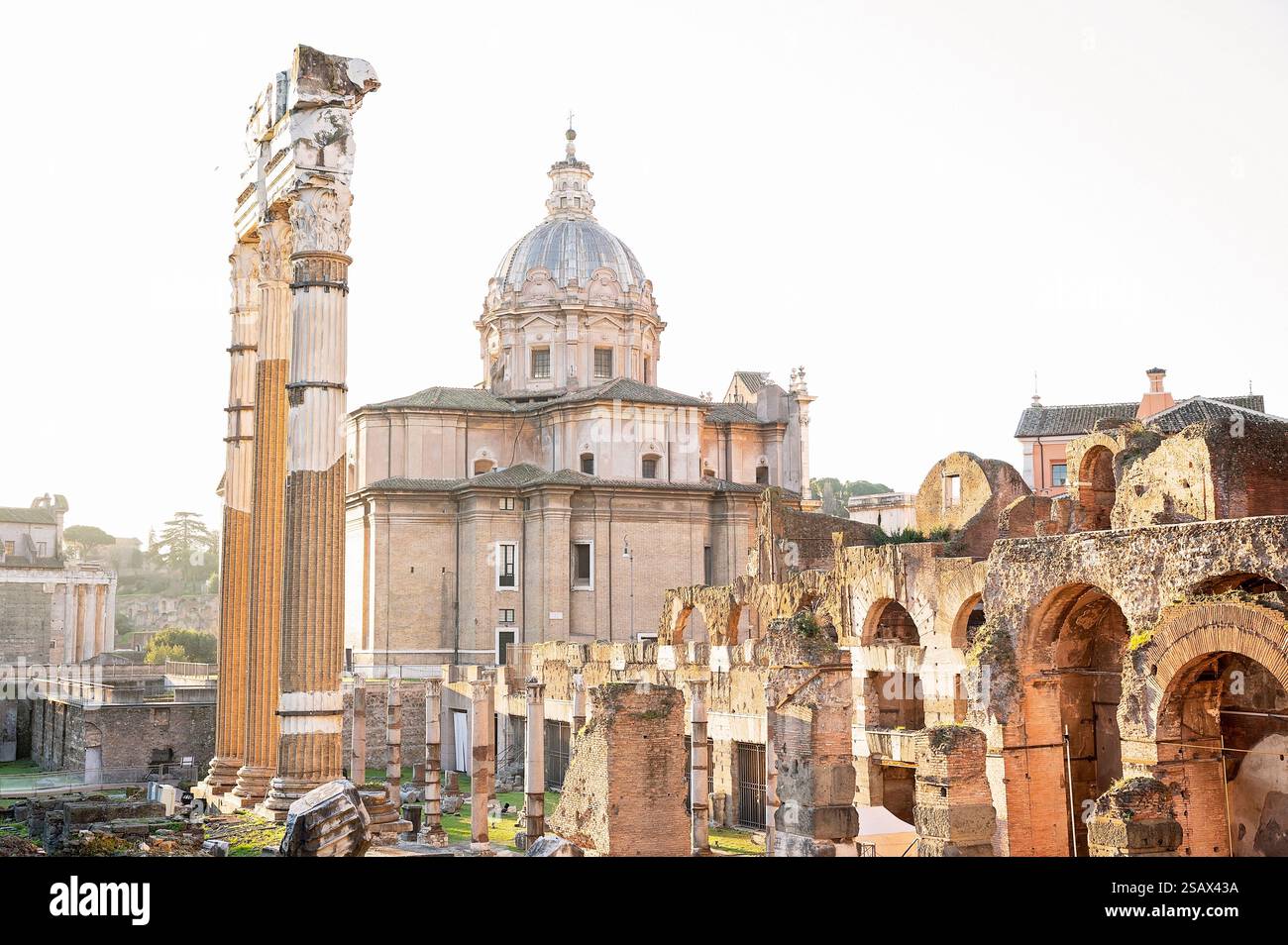 Ancient Roman ruins with a baroque church dome in Rome Stock Photo - Alamy