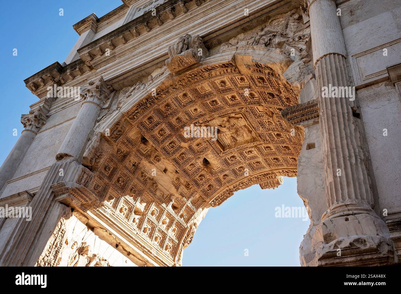 Low-angle view of a detailed ancient Roman triumphal arch Stock Photo ...