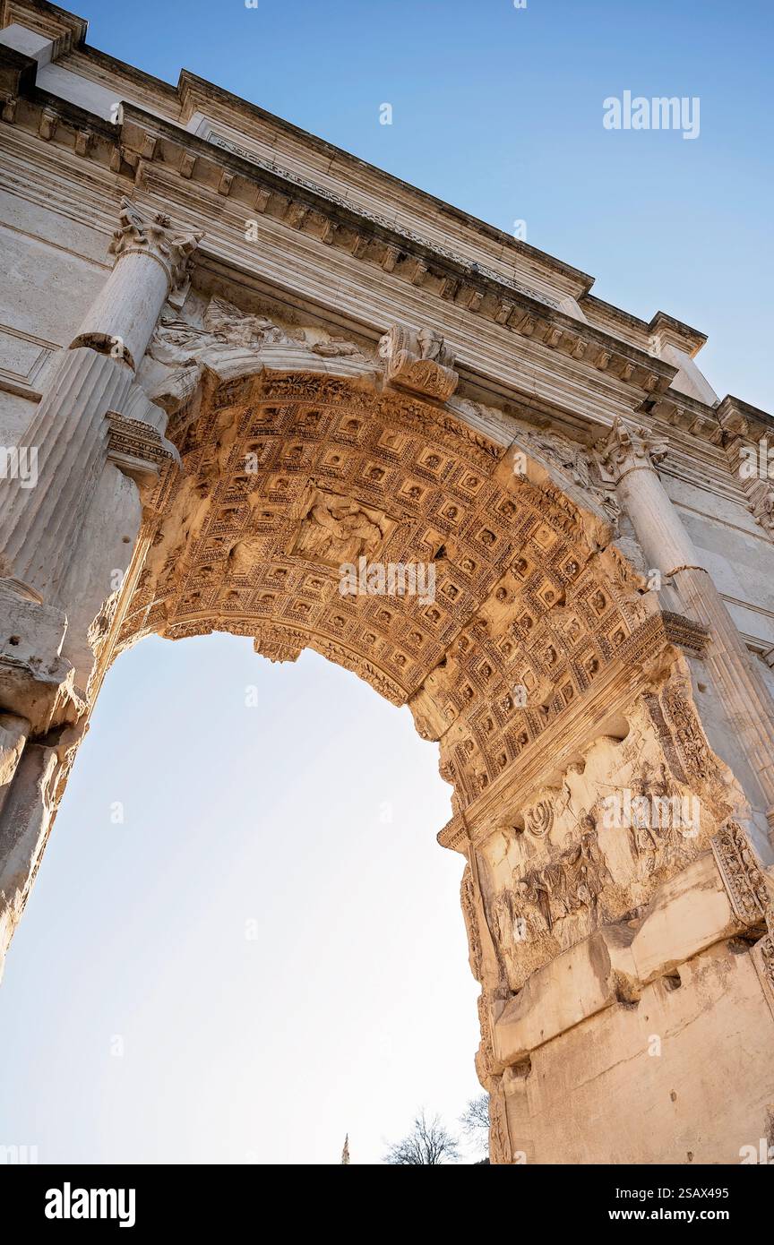 Low-angle view of an ornate ancient Roman triumphal arch Stock Photo ...