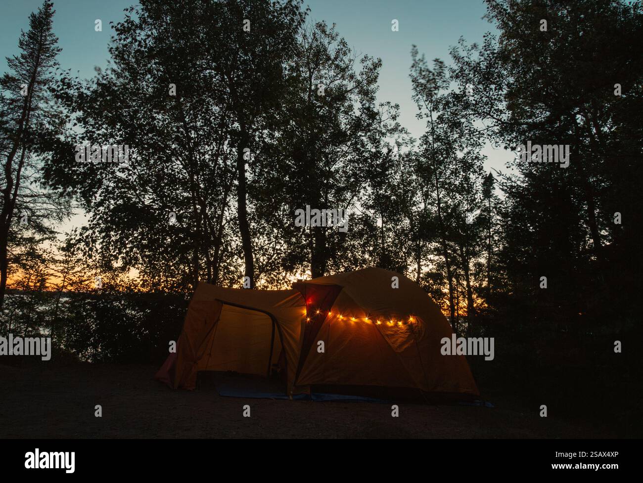 night time while camping with string lights on tent Stock Photo - Alamy