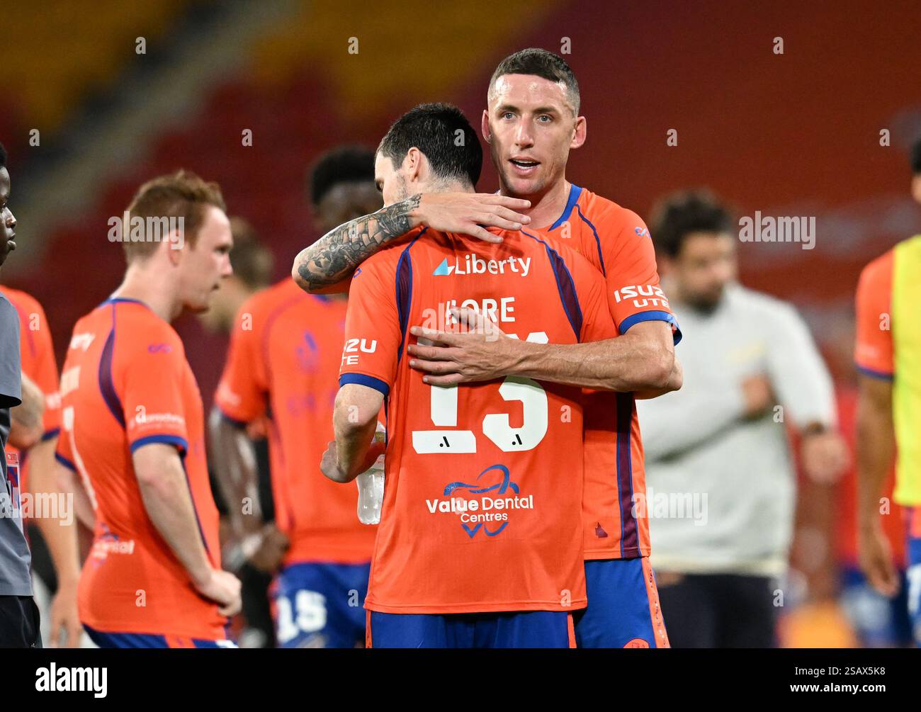 Brisbane, Australia. 31st Jan, 2025. Scott Neville of the Roar hugs ...