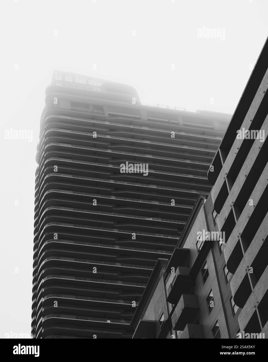 modern office building in the city dense fog Stock Photo - Alamy