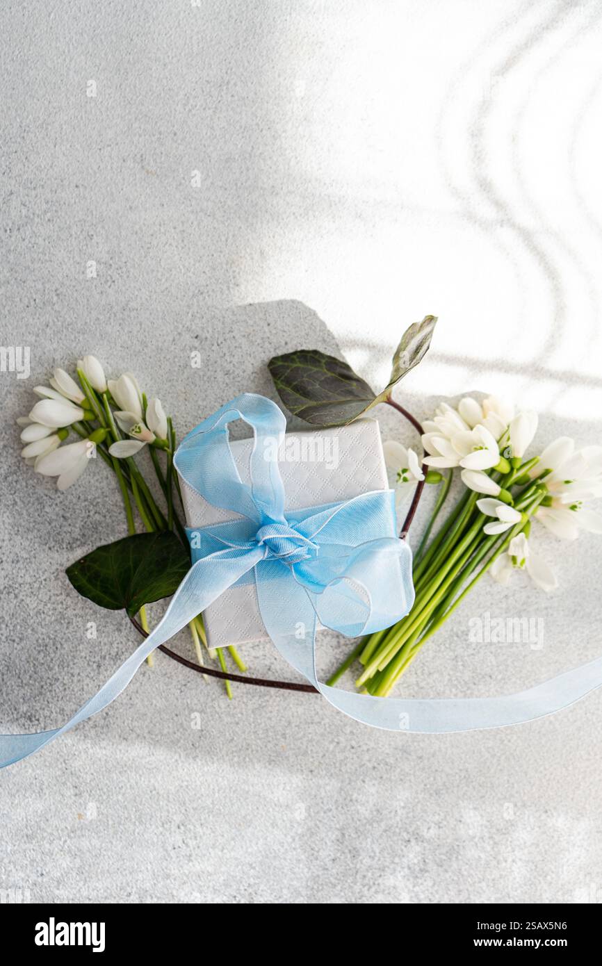 Gift box with pale blue ribbon Stock Photo - Alamy