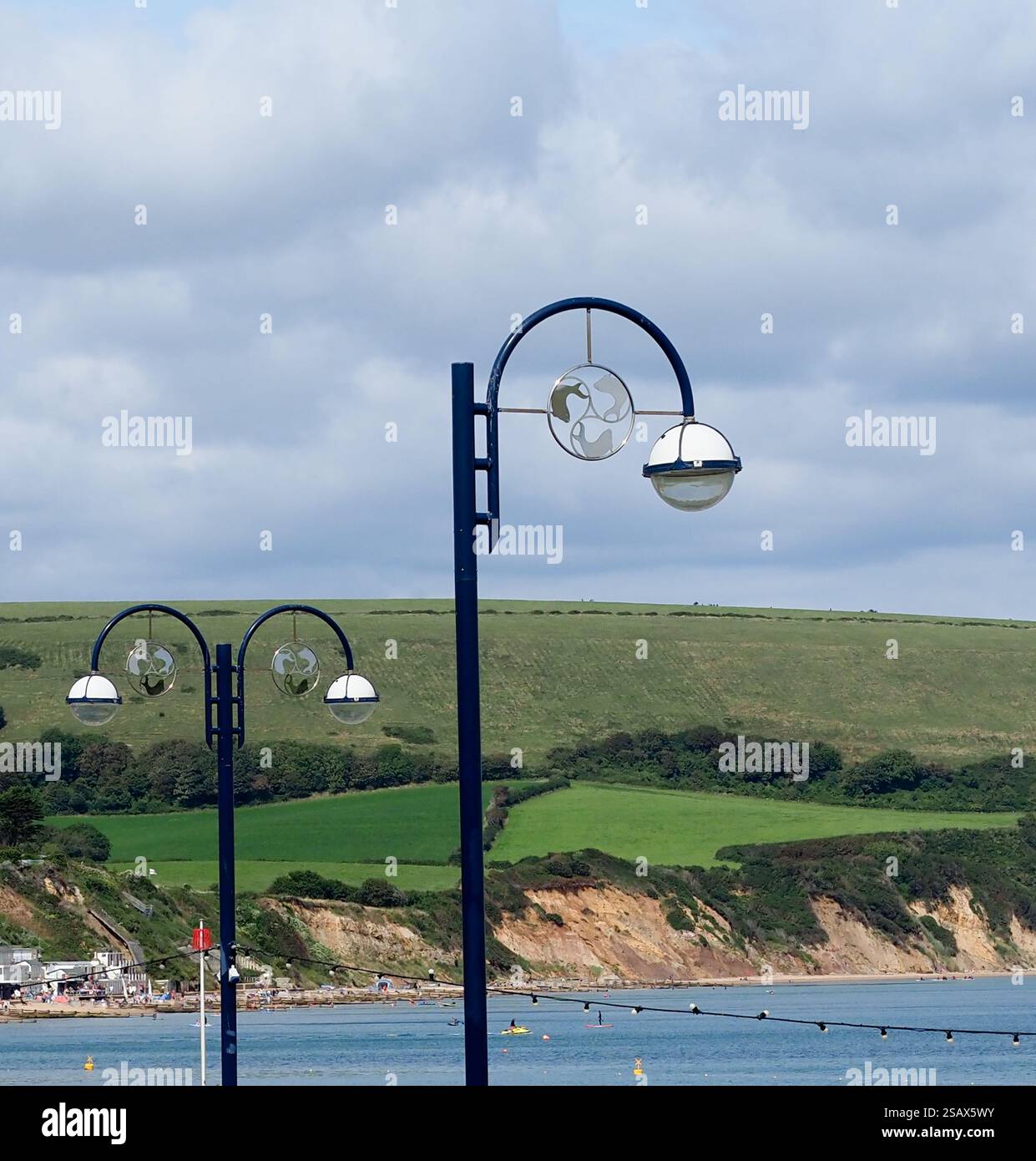 Decorative street lighting showing blue painted curved lamp post with ...