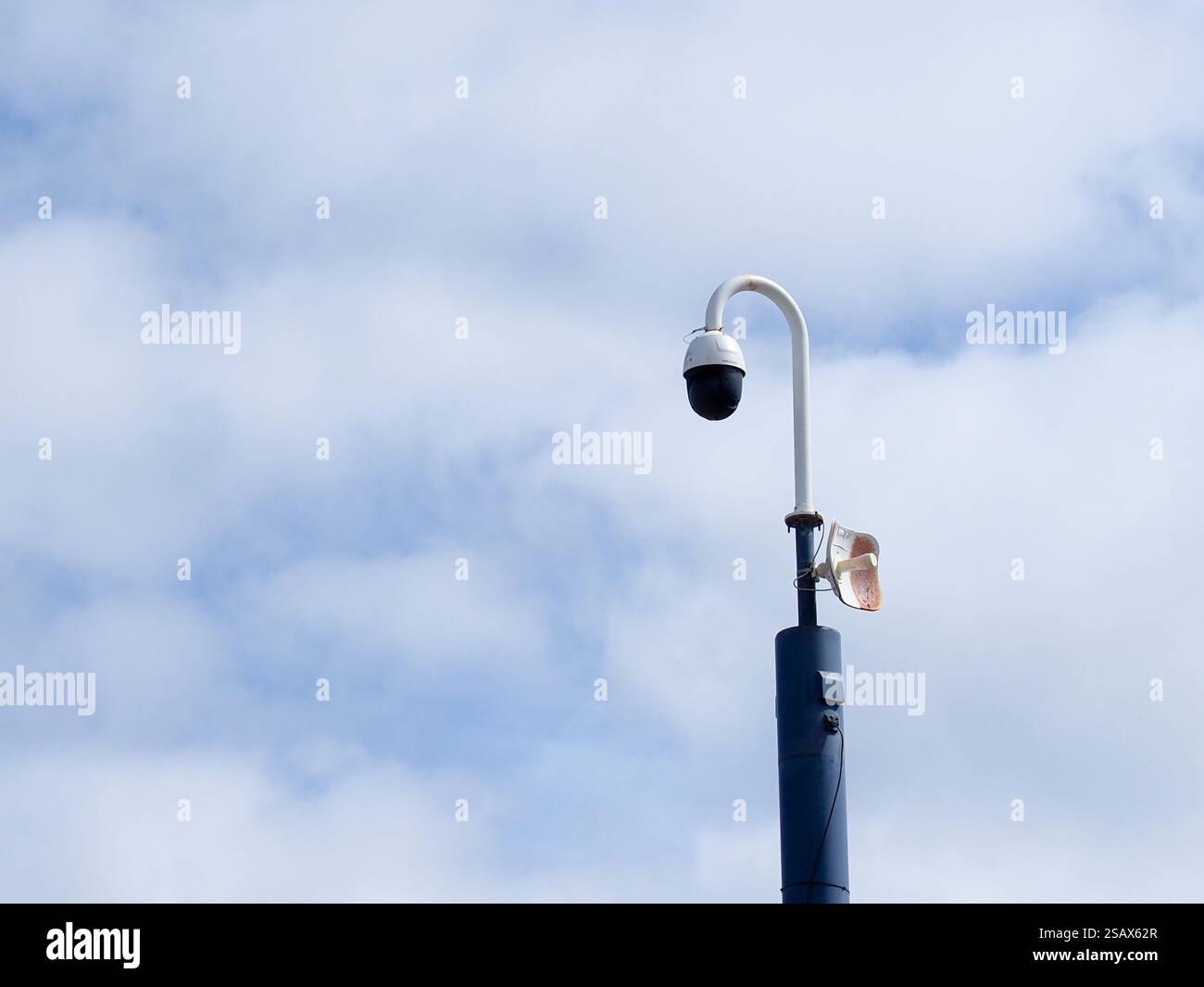 A modern CCTV camera placed on a high pole Stock Photo - Alamy
