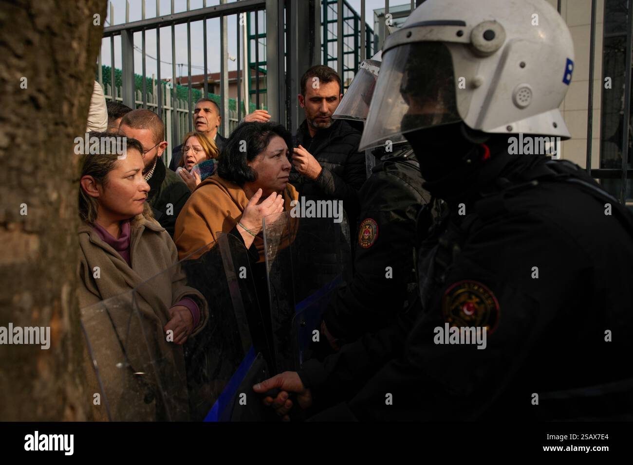 An Istanbul's Mayor Ekrem Imamoglu supporter talks to a Turkish police ...