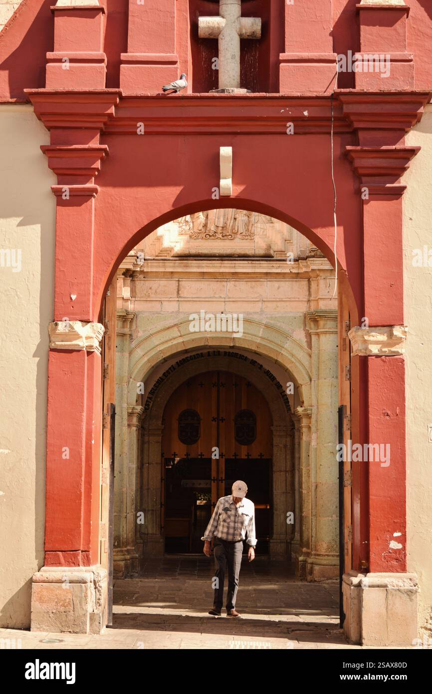 Oaxaca, Mexico. Man outside an old colonial church in Oaxaca City Stock ...
