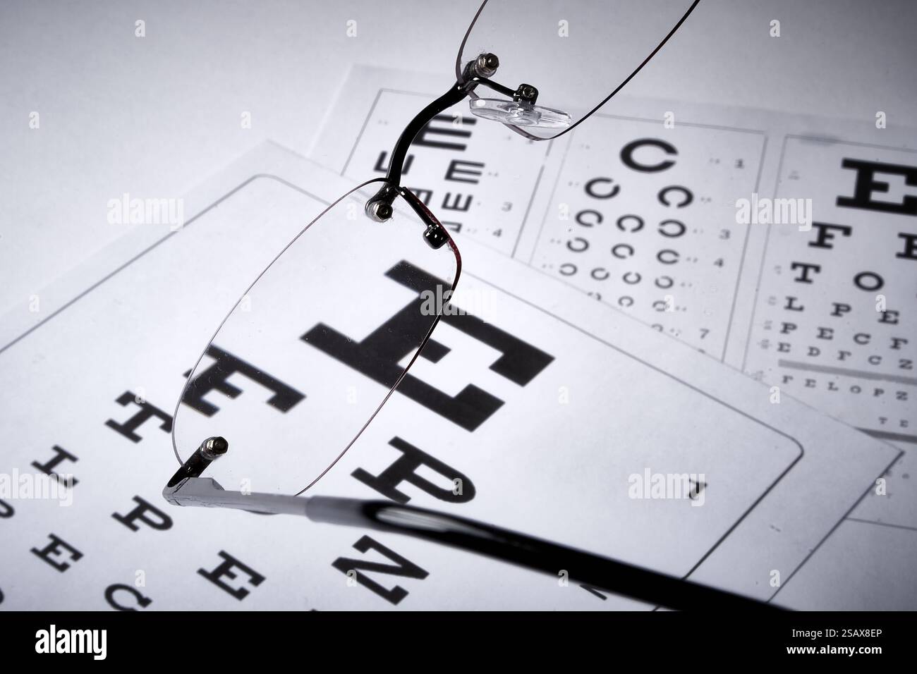 Reading glasses and eye charts Stock Photo - Alamy