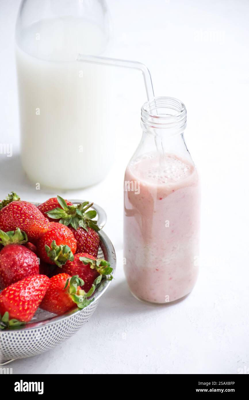 a glass of strawberry shake shown Stock Photo - Alamy