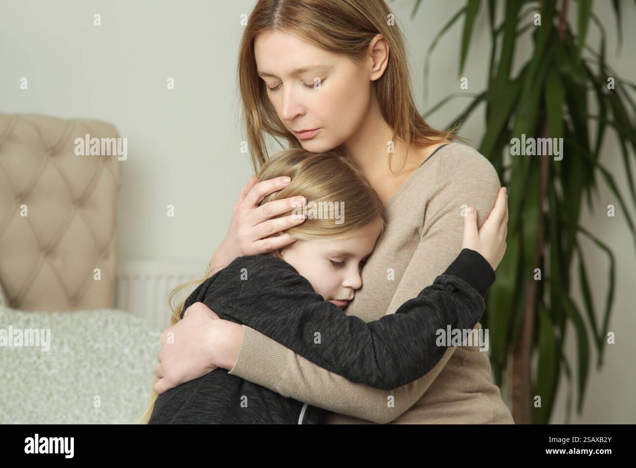 Loving worried mom consoling her sad little girl Stock Photo - Alamy