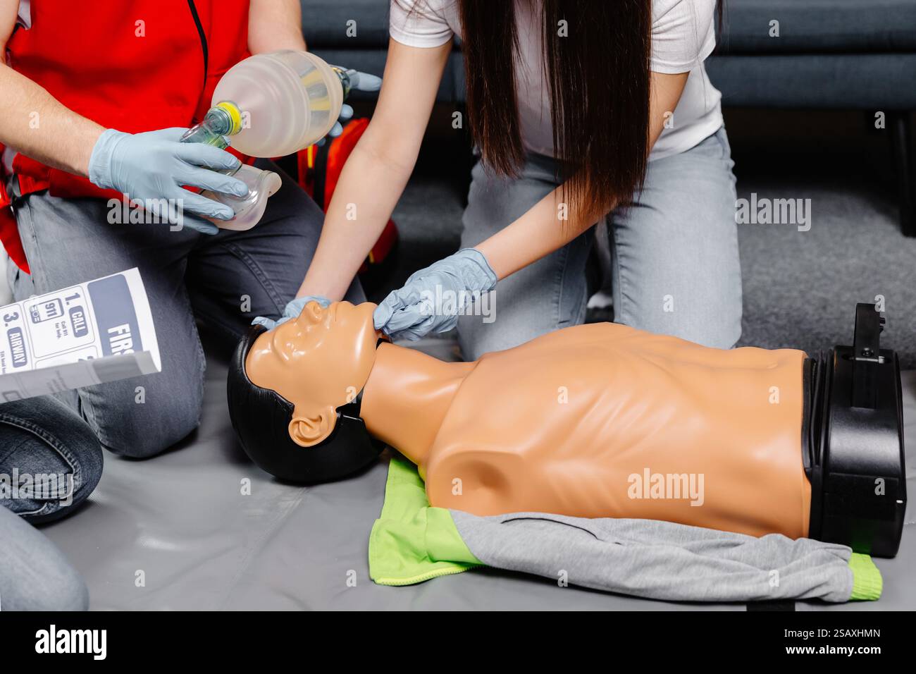 Woman holding breathing bag Ambu bag.Demonstrating CPR Cardiopulmonary resuscitation training ...