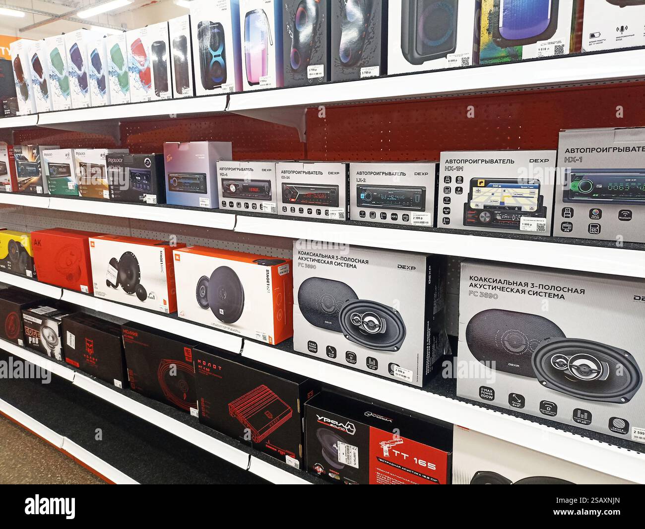 Car audio systems display on store shelves with various speaker and ...