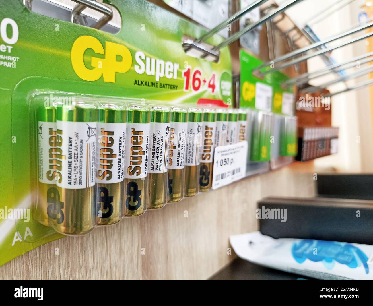 Close-up of aa gp super alkaline batteries on display shelf in store ...