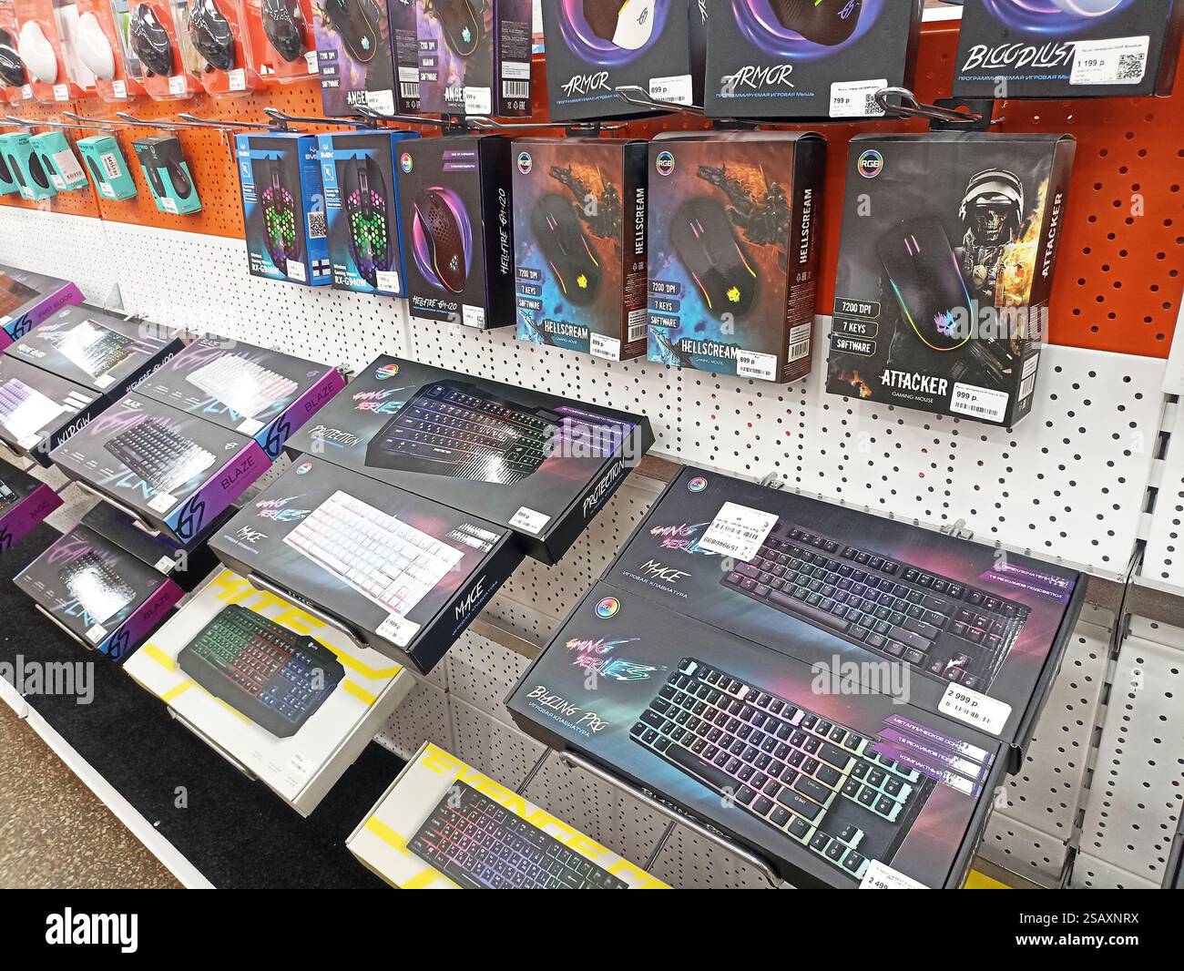 Gaming keyboards and mice display in electronics store Stock Photo - Alamy