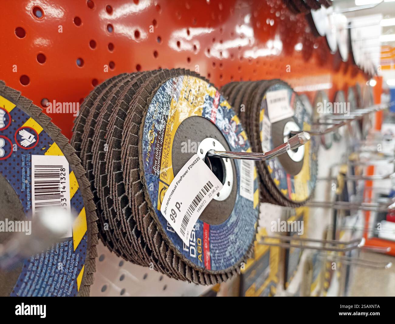 Grinding discs display on perforated metal wall in hardware store Stock ...