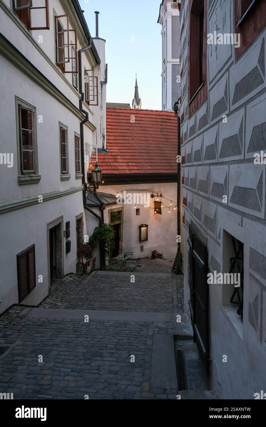 Cozy Alley with String Lights and Outdoor Seating Stock Photo - Alamy