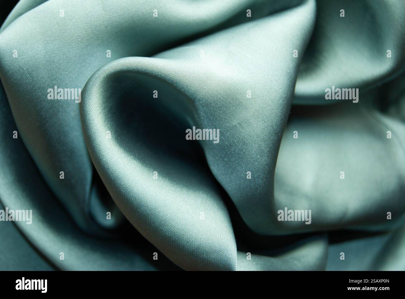 Soft light grey silk fabric with delicate folds and smooth texture ...
