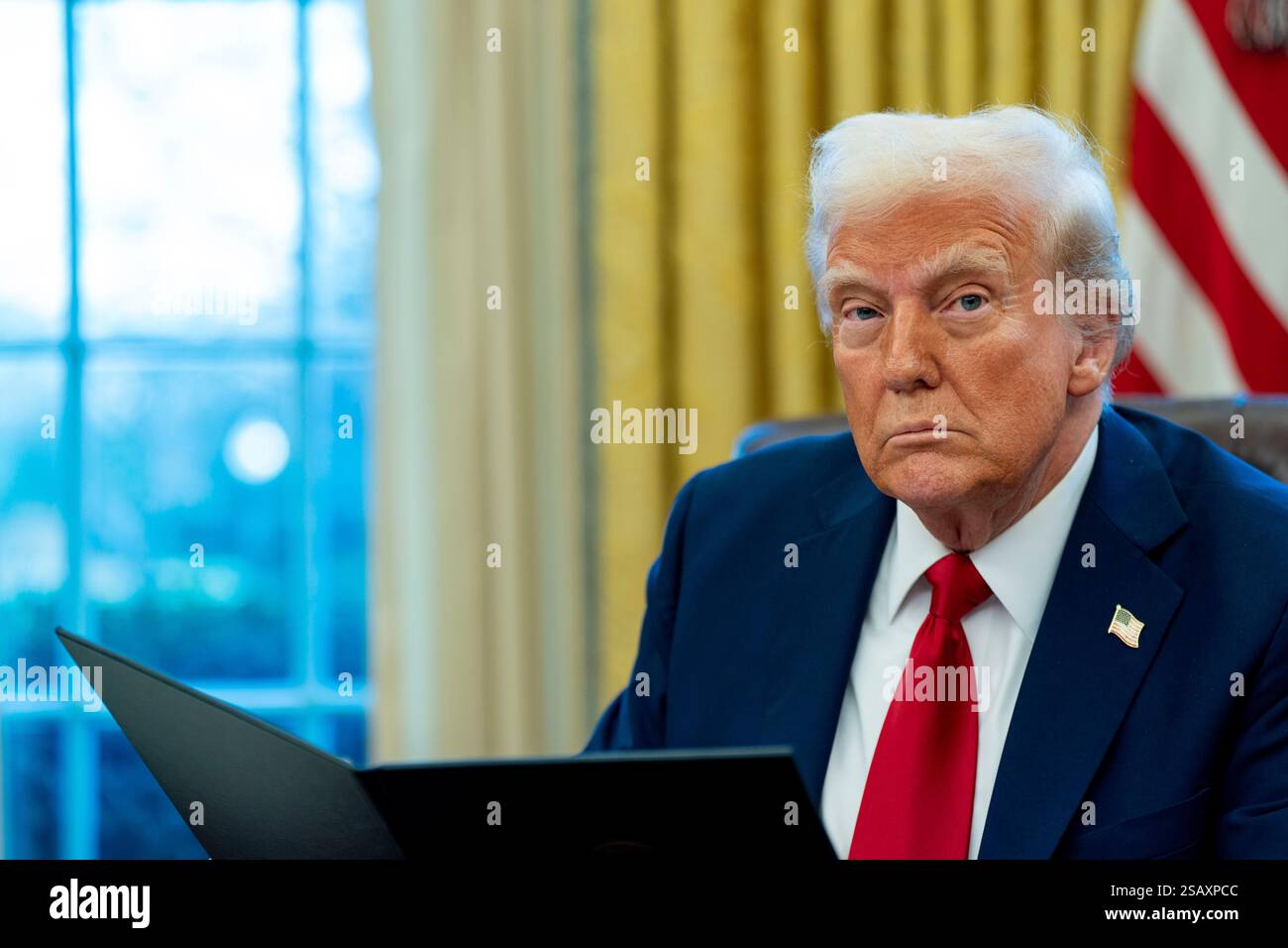 United States President Donald Trump signs two executive orders in the ...