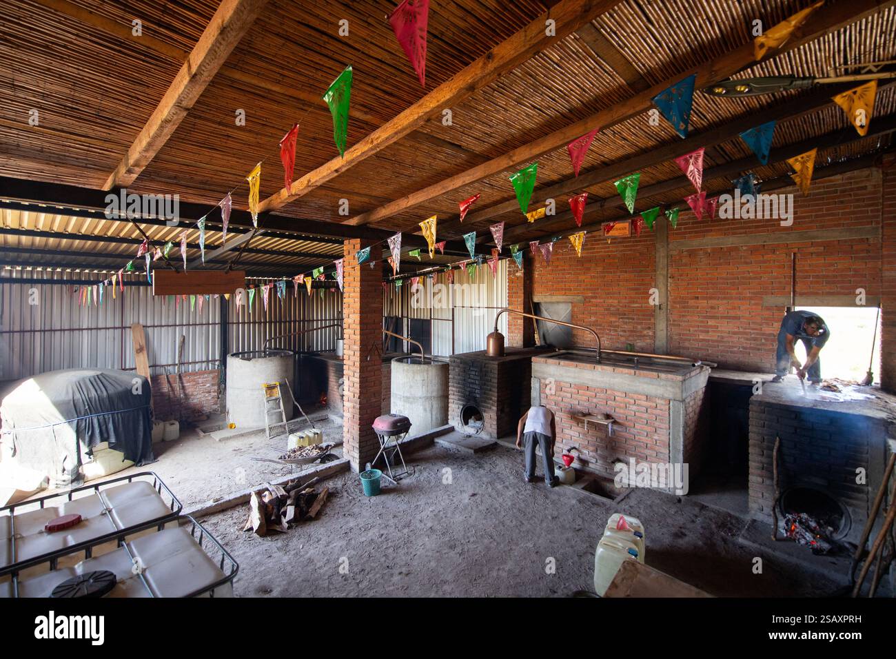 Mezcal is fermented and distilled in copper still tanks in artisanal ...