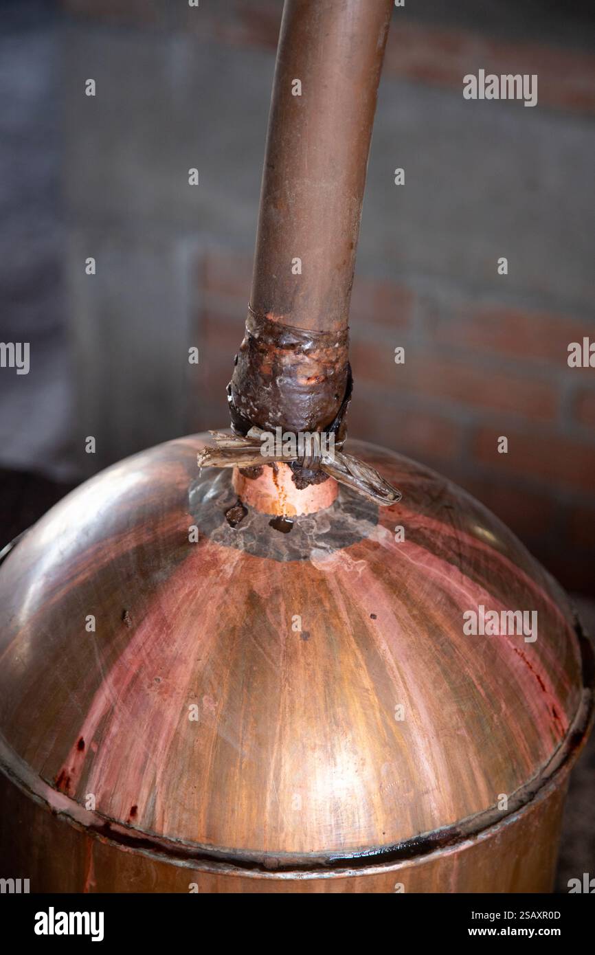 Mezcal is fermented and distilled in copper still tanks in artisanal ...