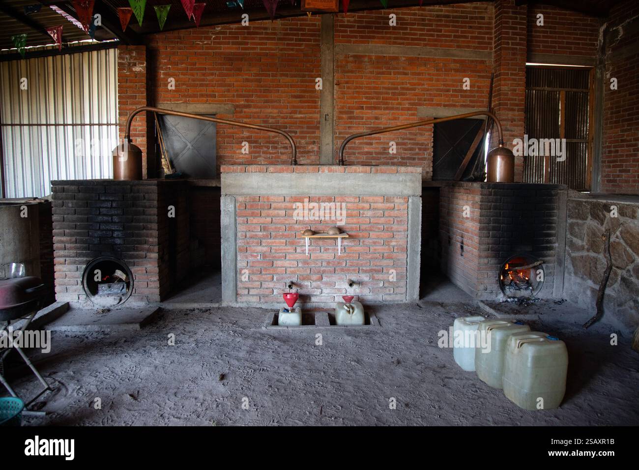 Mezcal is fermented and distilled in copper still tanks in artisanal ...