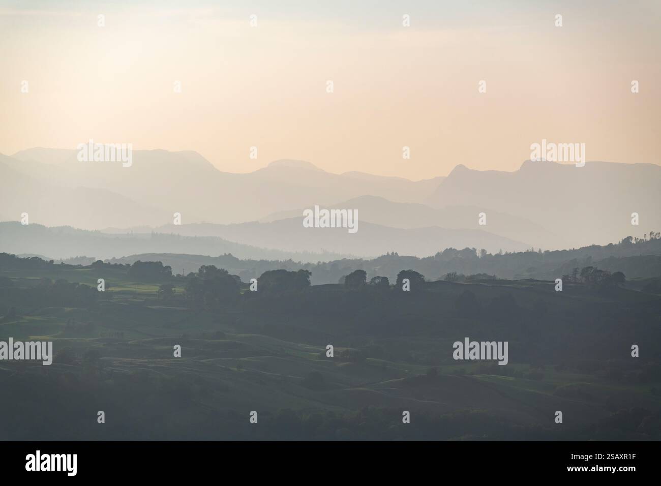 View of distant fells from Scout Scar near Kendal, Lake District ...