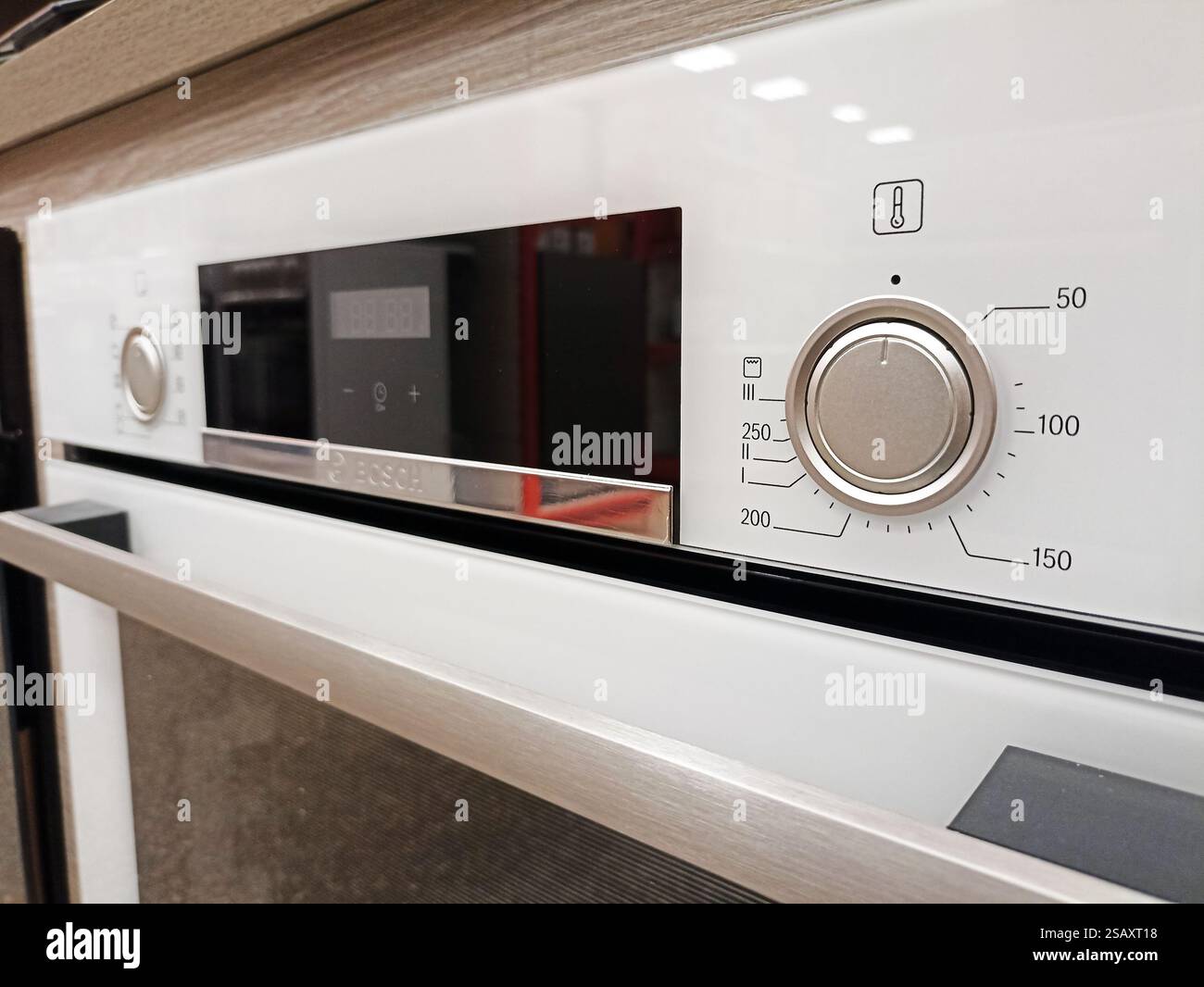 Modern stainless steel built-in electric oven with digital display and ...