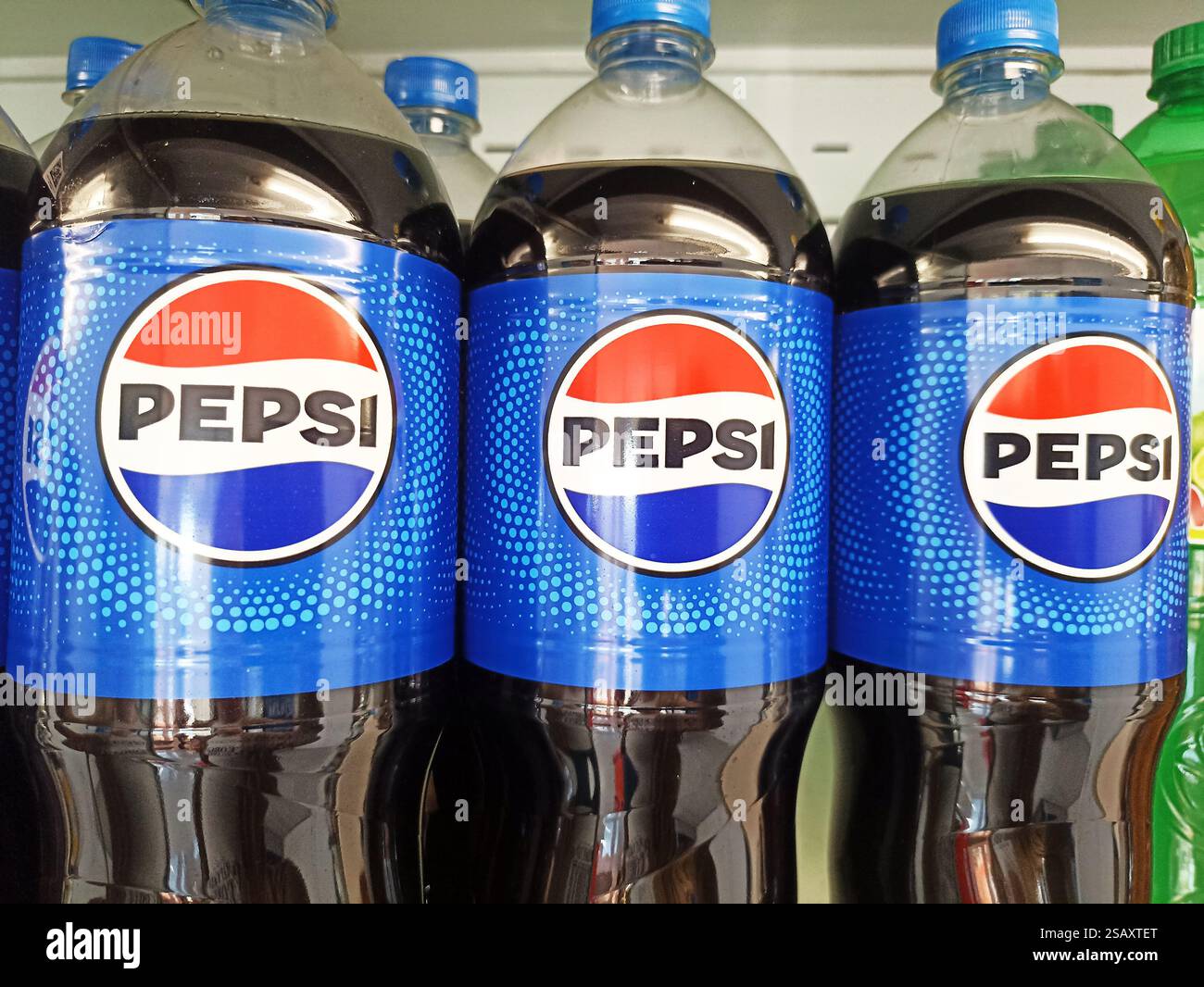 Pepsi bottles on shelf display in grocery store Stock Photo - Alamy