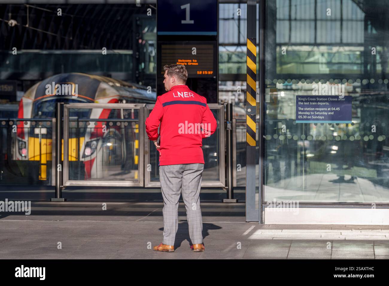 LNER staff are seen outside King's Cross mainline station, on 30th ...