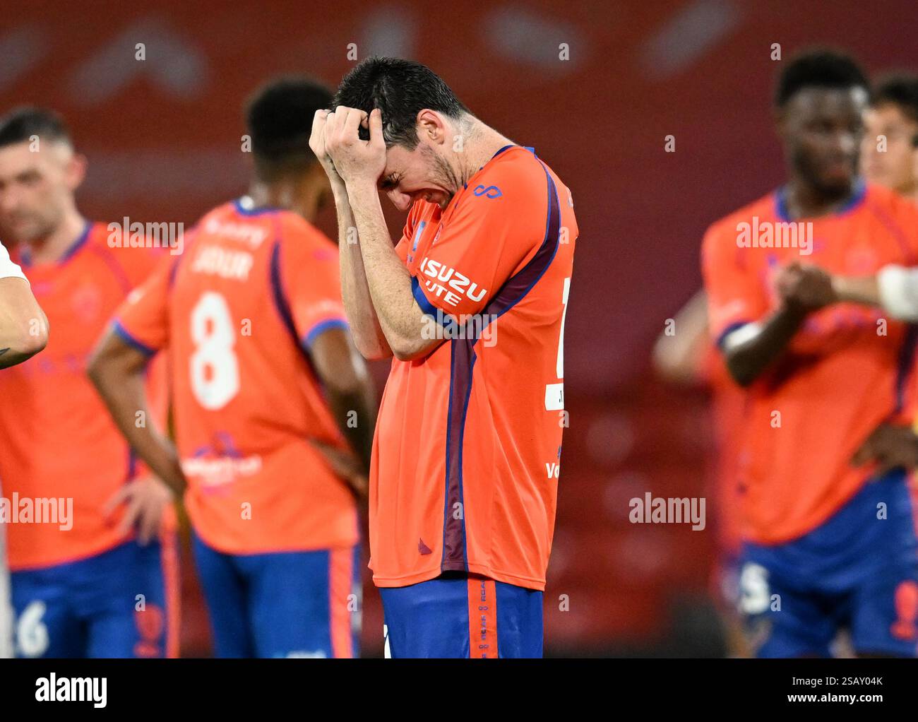 Henry Hore (centre) of the Roar reacts after losing the A-League Men ...