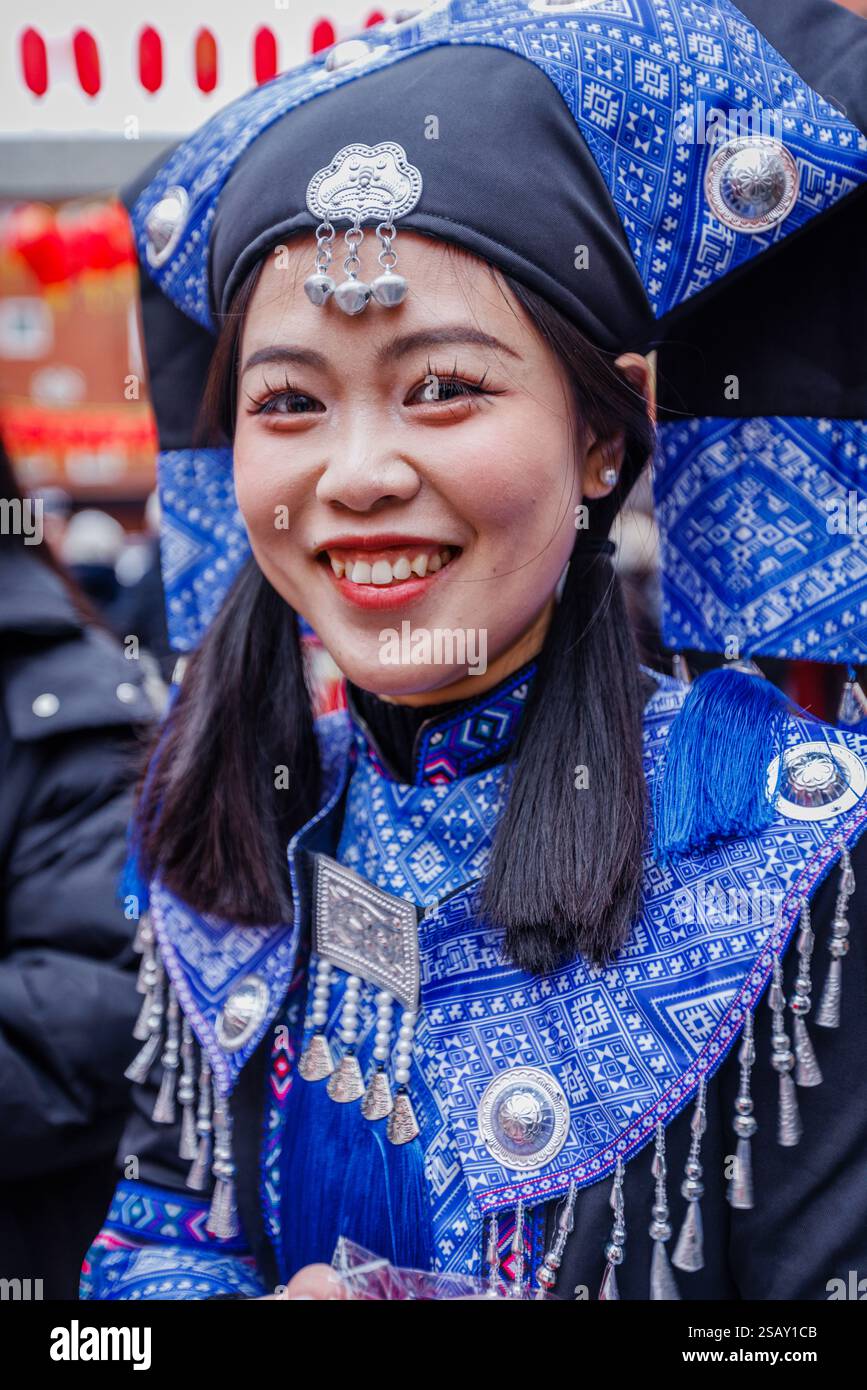 A portrait of a smiling chinese lady traditionally dressed in London's ...