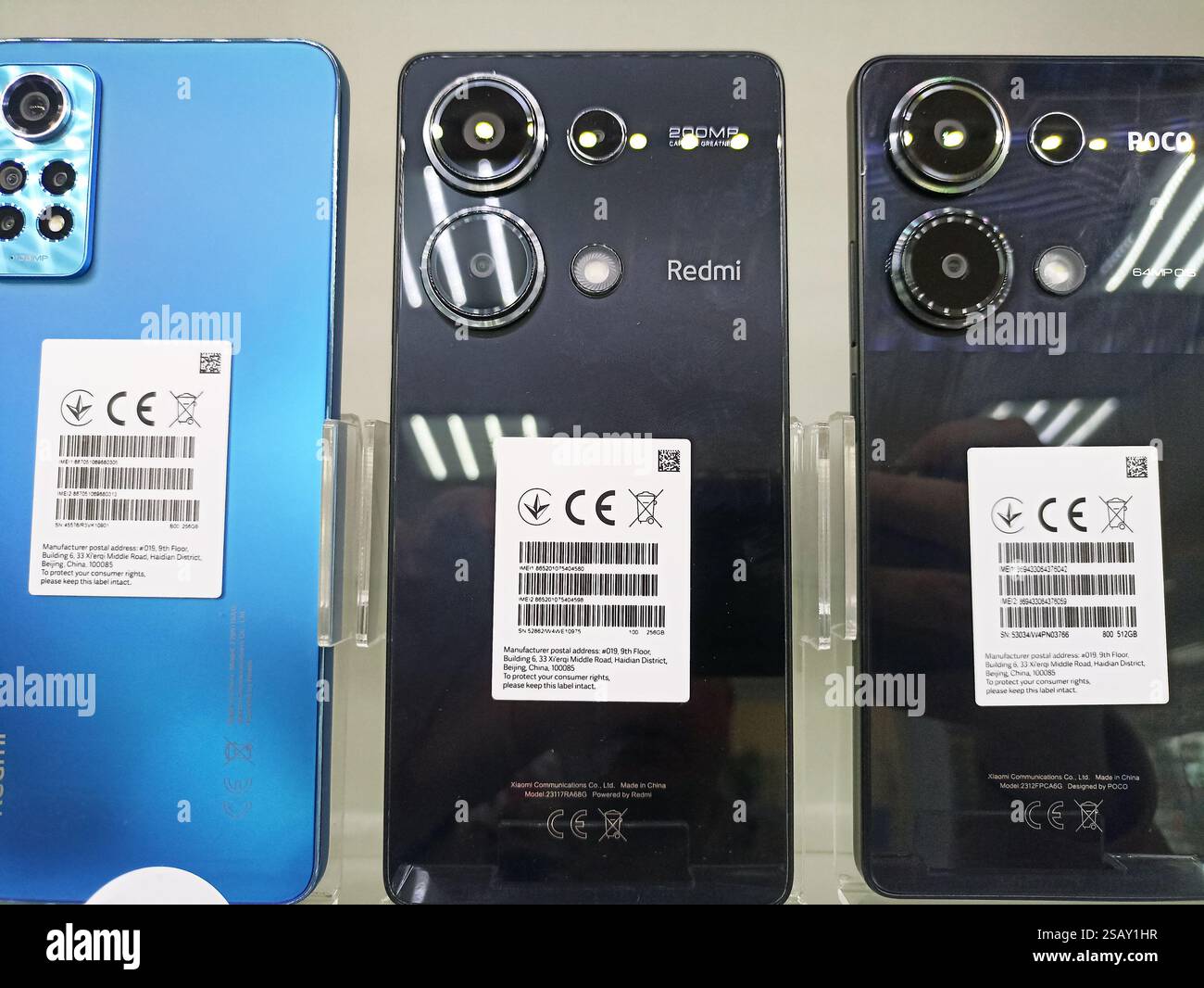Three modern smartphones on display with distinct camera designs and ...