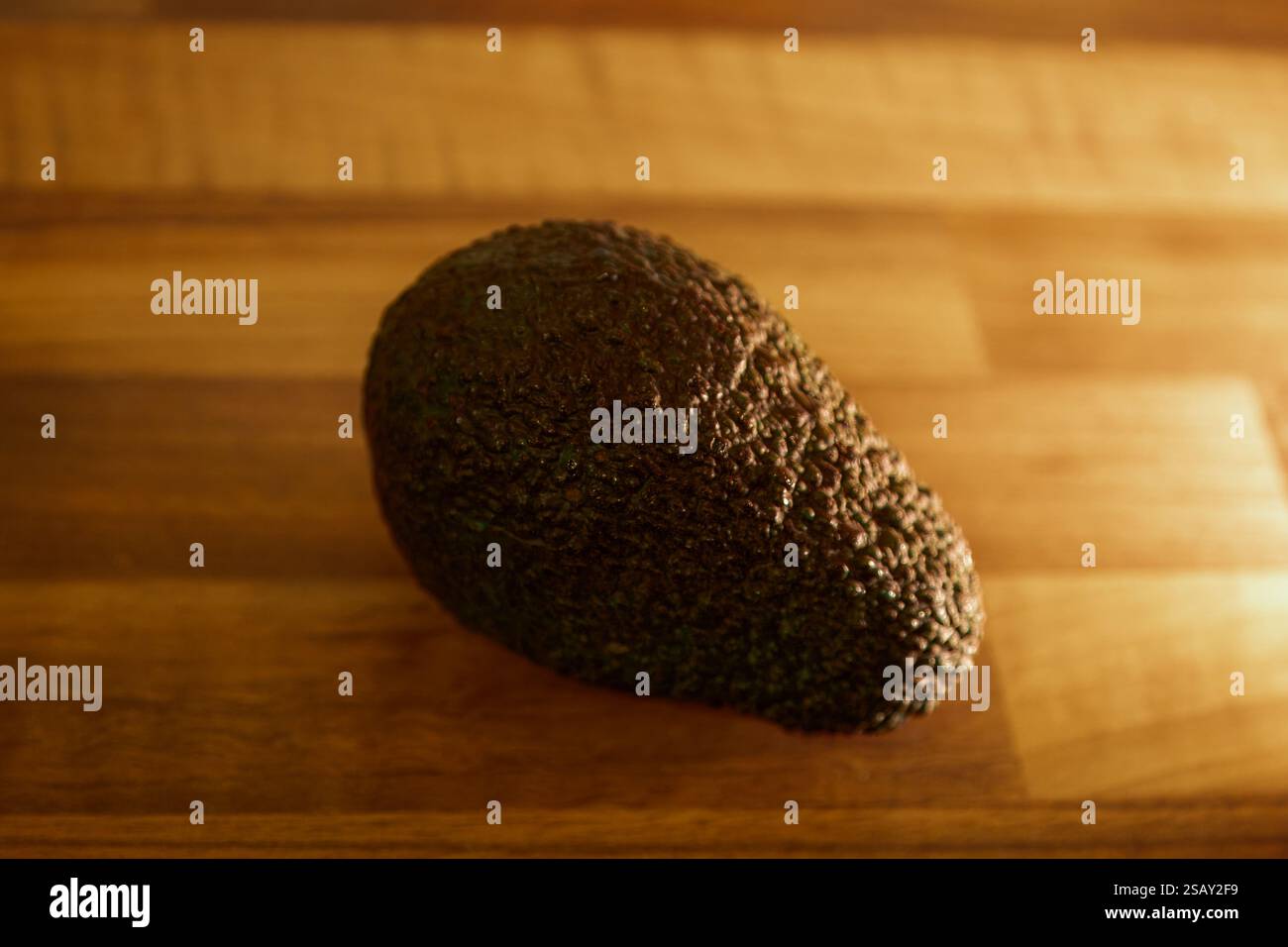 Avocado in stages of being prepared, close up skin textures Stock Photo ...