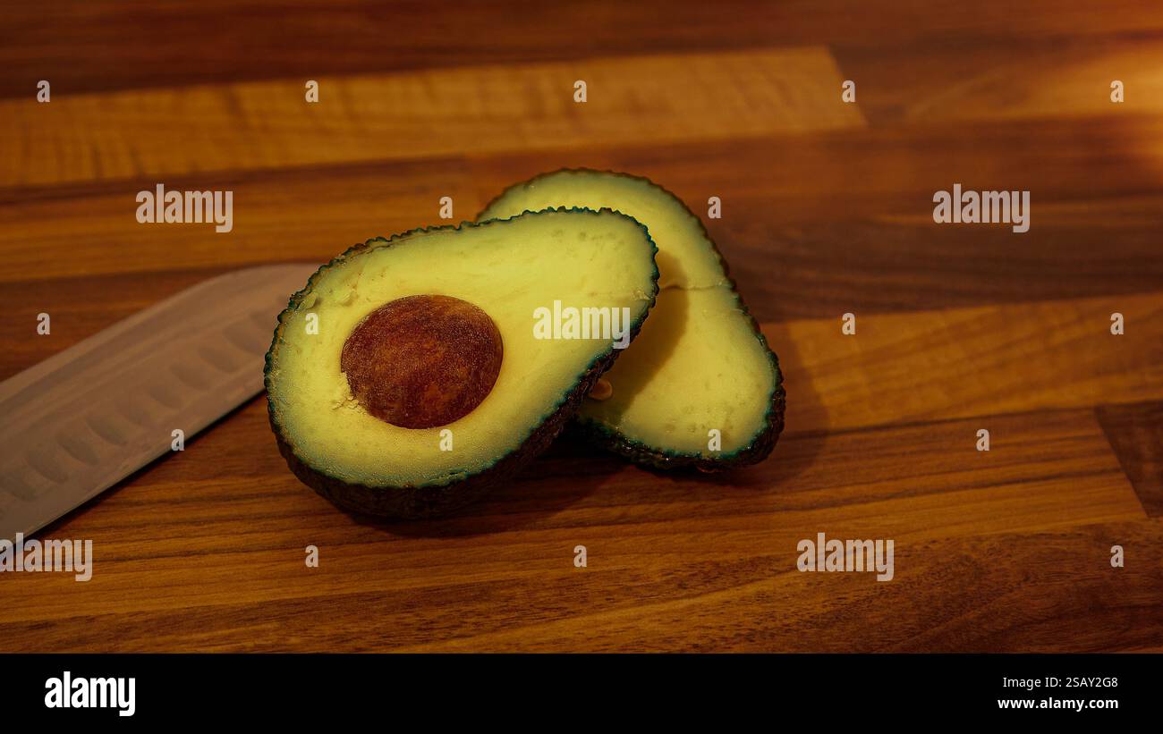 Avocado in stages of being prepared, close up skin textures Stock Photo ...