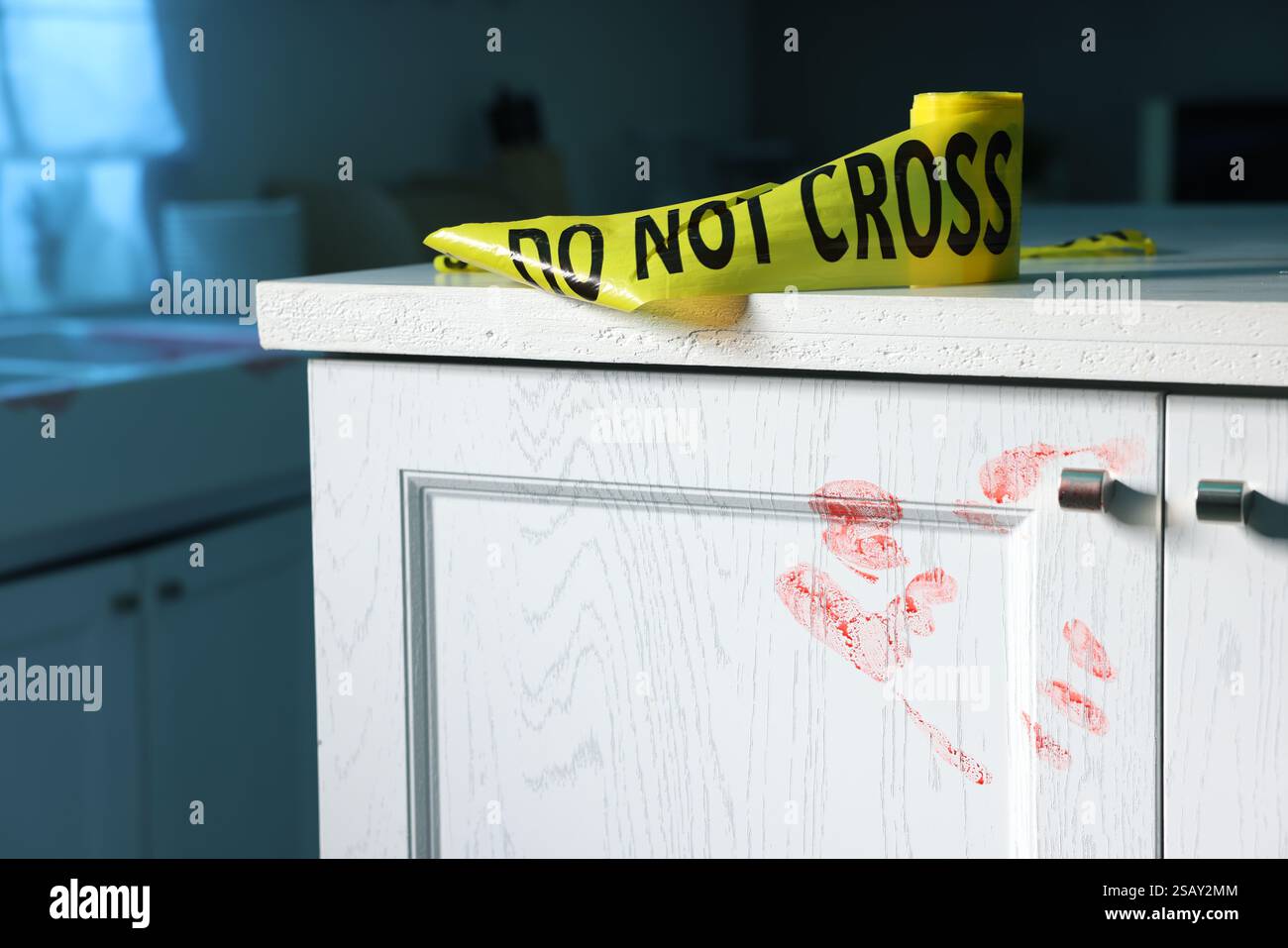 Yellow crime scene tape and bloody handprint on chest of drawers in ...