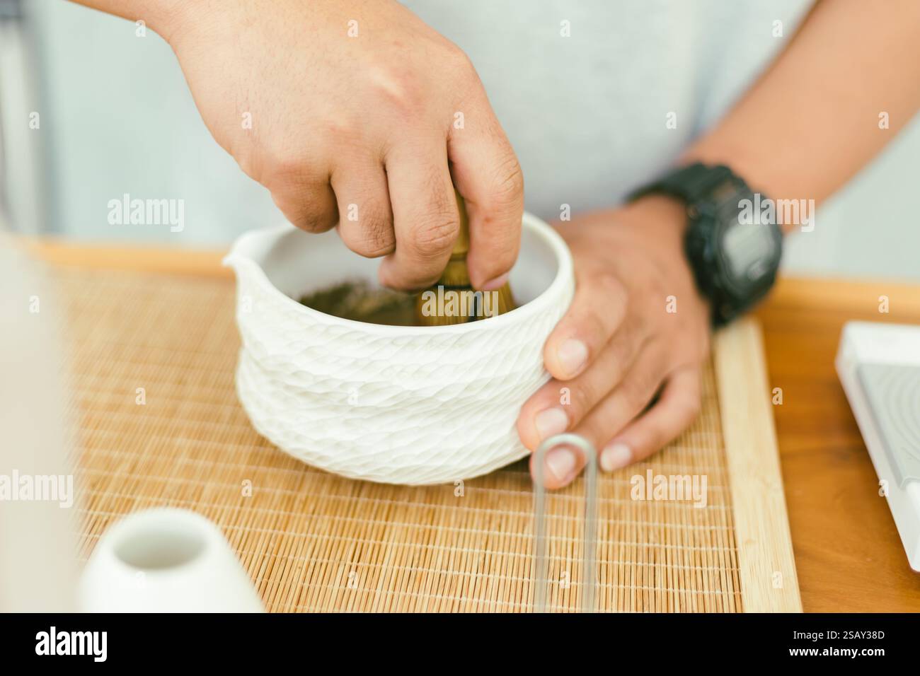 Barista make Hojicha milk latte, Cafe menu Stock Photo - Alamy