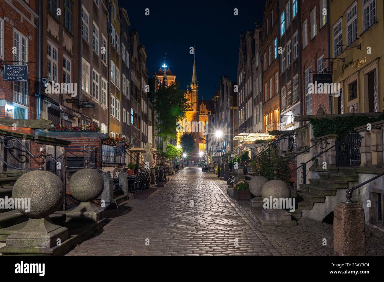 This is a night view of a street in the old town of Gdansk, a popular ...