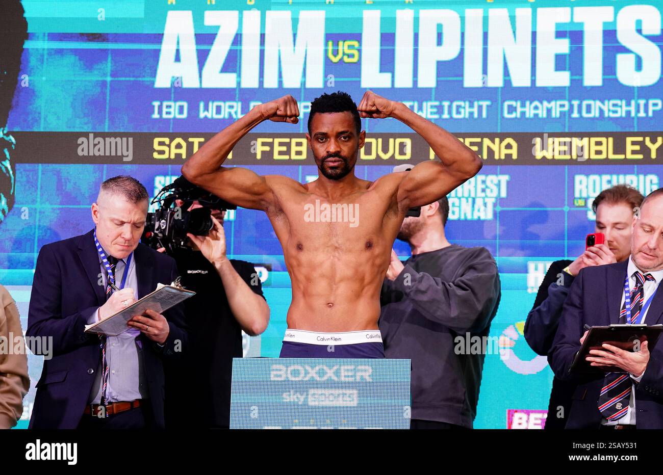 Emmanuel Kalombo on the scales during the weigh-in at BOXPARK Wembley, London. Adam Azim is set ...