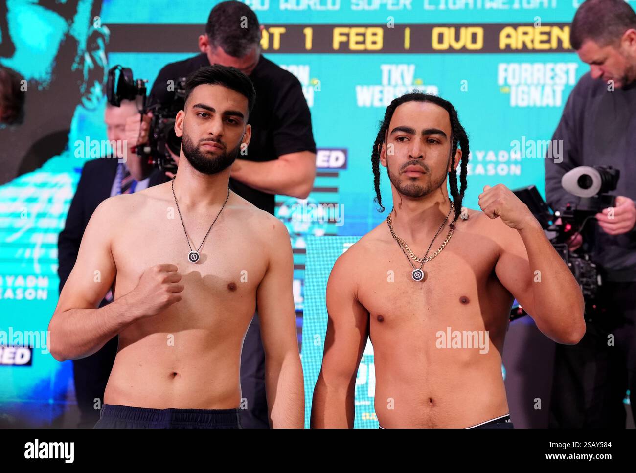 Hassan Azim (left) and Jensen Irving (right) following a weigh in ...