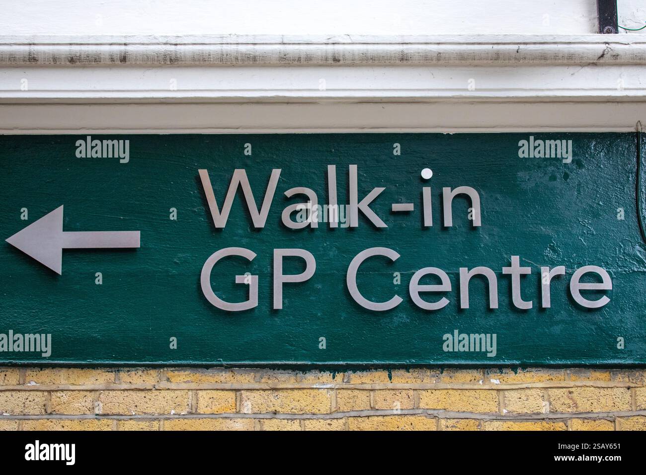 Close-up of a sign on the exterior of a Walk-in GP Centre in London, UK ...