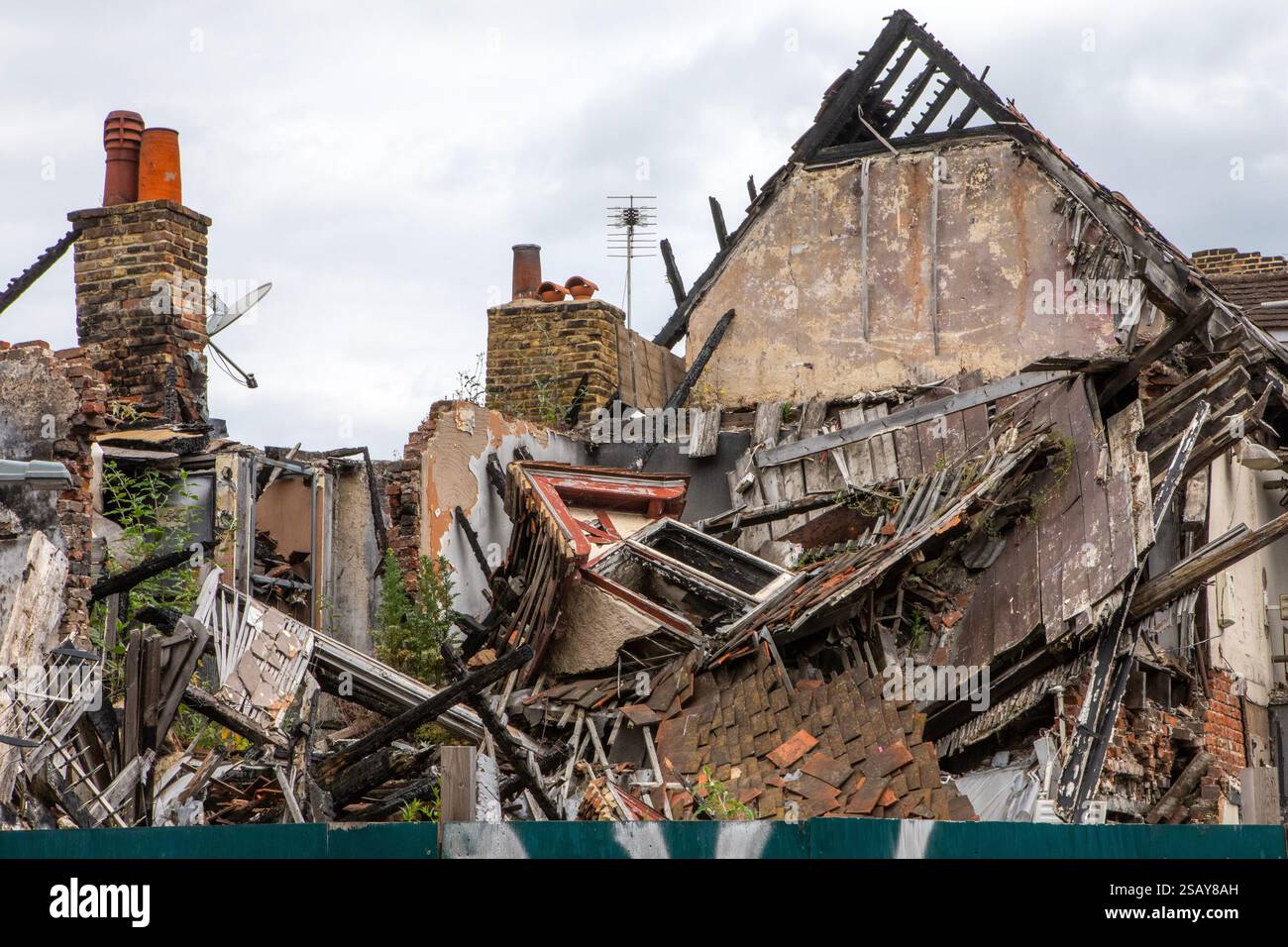 A view of a demolished, or falling down house in a suburban area Stock ...