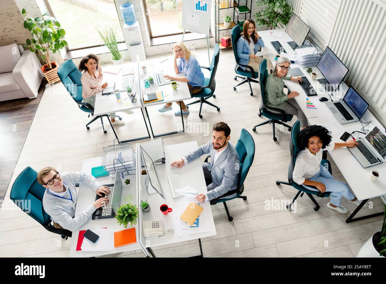Diverse team working collaboratively in modern office setting ...