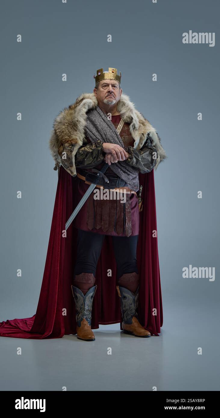 Full-length portrait of elderly man, medieval king in fur-lined cloak ...