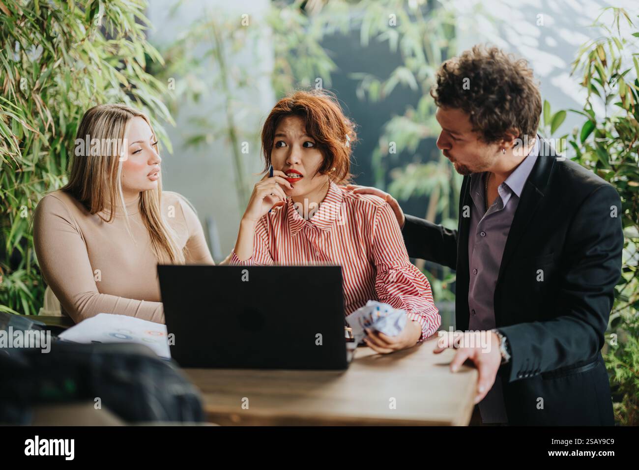 Concerned business team having a serious discussion at the office Stock ...