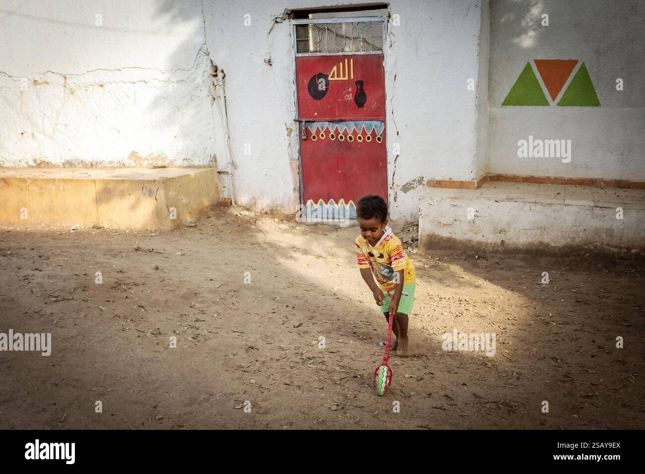 Small Egyptian child playing near the house in Aswan Upper Egypt Stock ...