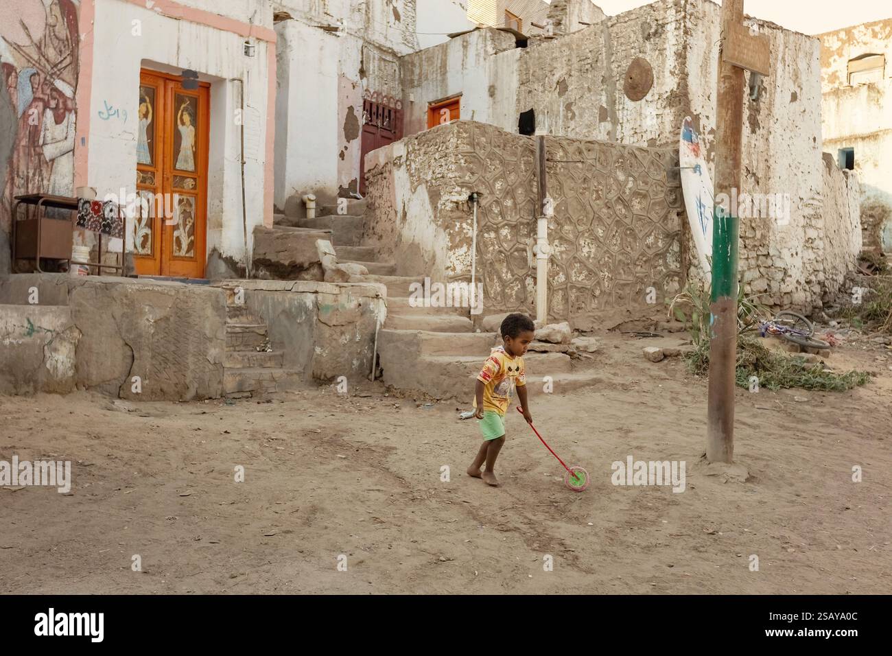 Small Egyptian child playing near the house in Aswan Upper Egypt Stock ...