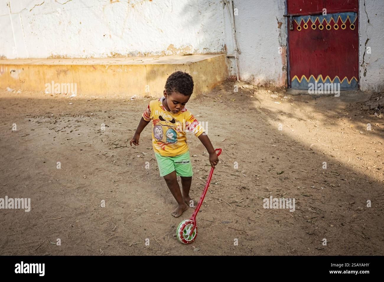 Small Egyptian child playing near the house in Aswan Upper Egypt Stock ...