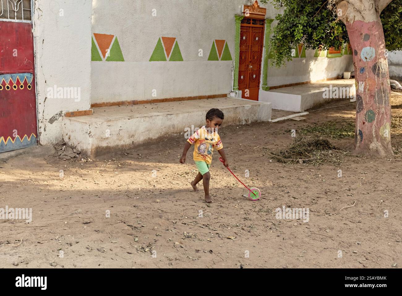 Small Egyptian child playing near the house in Aswan Upper Egypt Stock ...
