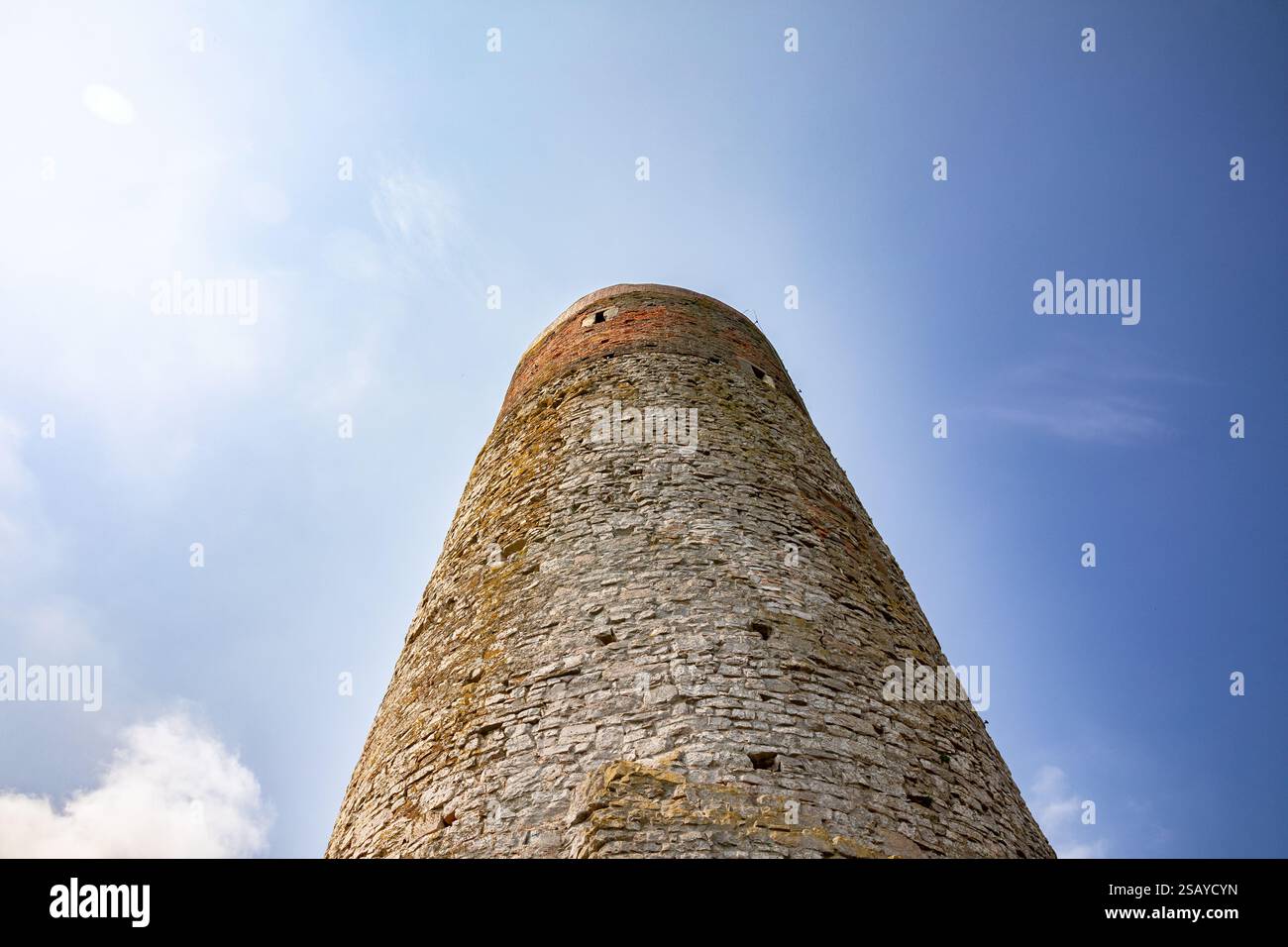 An Ancient Stone Tower Majestically Stands Under a Clear Sky Full of ...