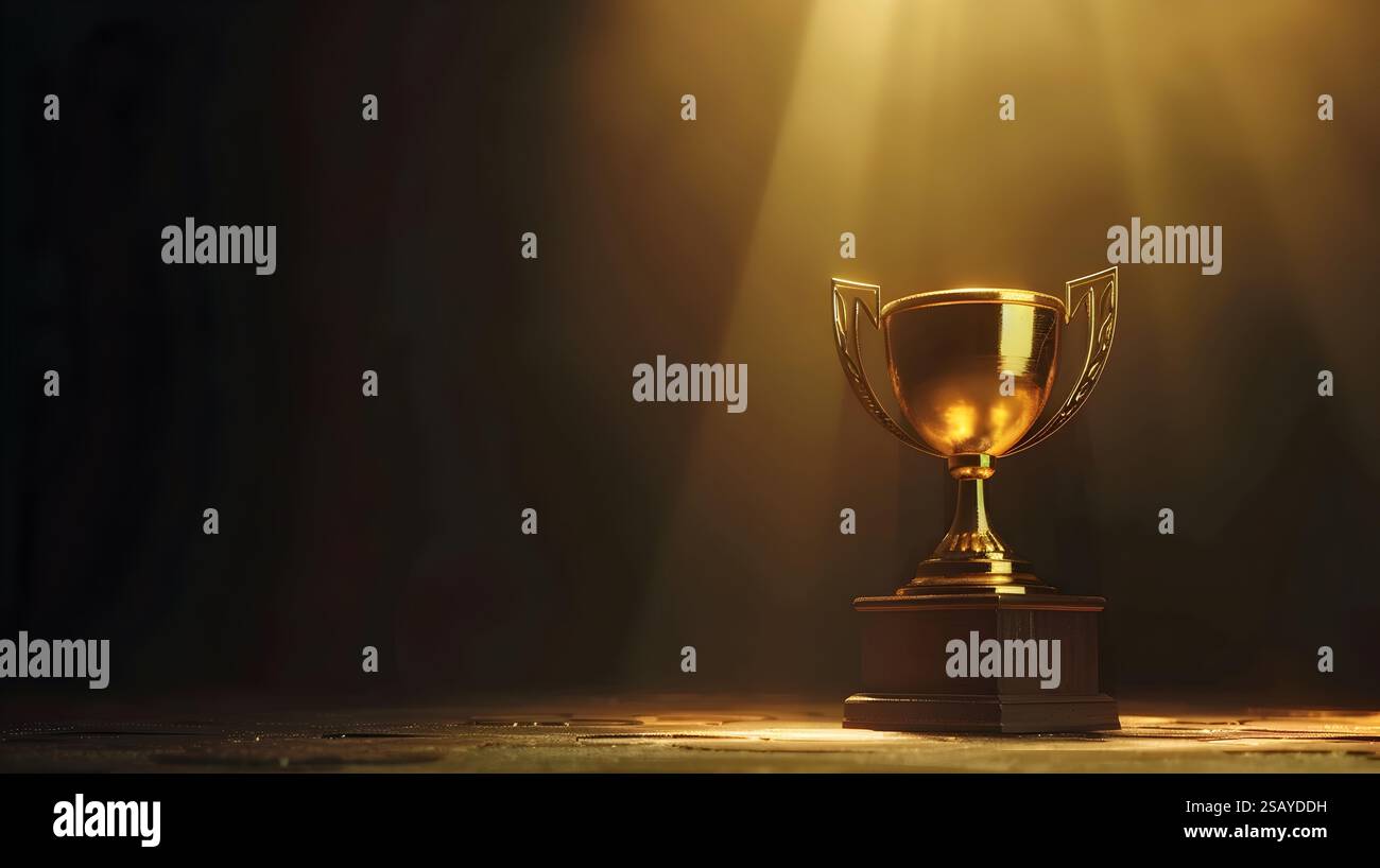 A majestic golden trophy stands tall on a dimly lit pedestal,bathed in ...